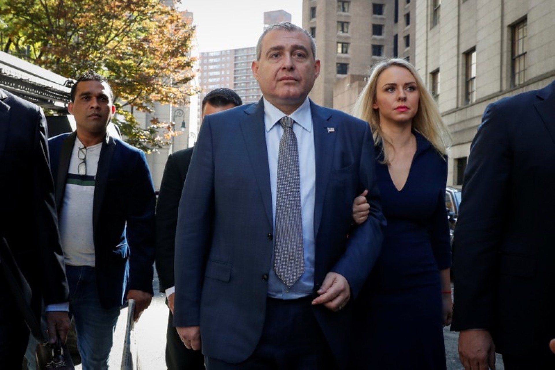 Giuliani associates accused of funneling money to pro-Trump group plead ...