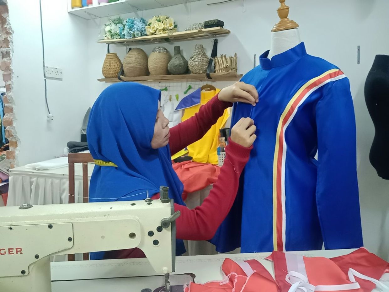 Malaysian tailor stitches Merdeka outfits inspired by epic 'Mat Kilau ...