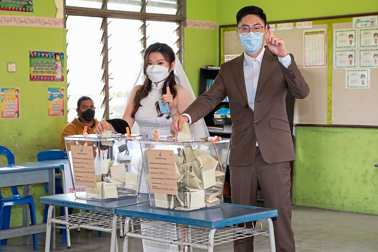 Couple head to polling centre first before getting married | The Star
