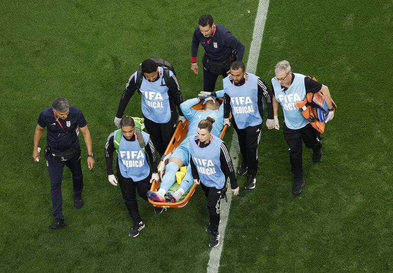 Football: Soccer-Iran keeper carried off after suffering head injury ...
