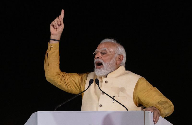 Modi's home state Gujarat votes, seen as easy mid-term test for India's ...