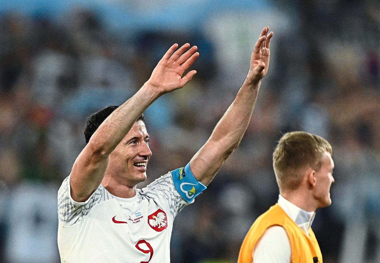 Football: Striker Lewandowski celebrates ‘happy defeat’ as Poland ...