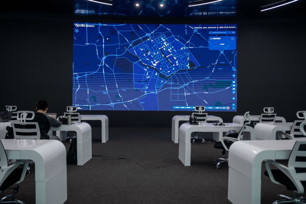 Cabs without a chatty – or any – driver are expanding in China | The Star