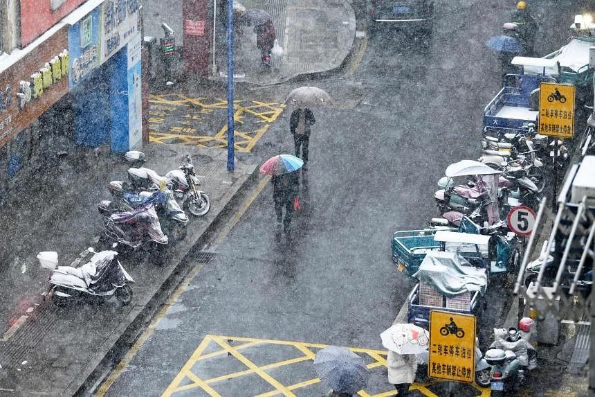 China issues blue alert as cold wave sweeps across central, eastern ...