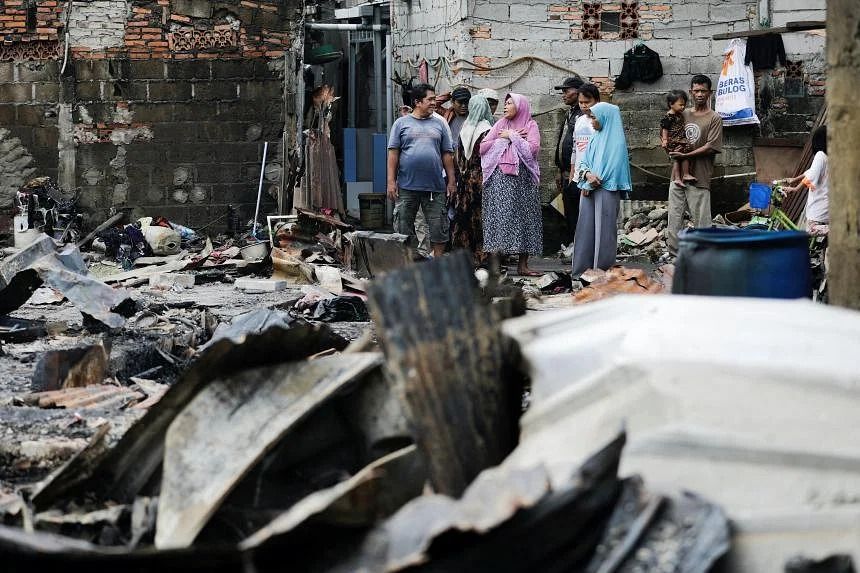 Indonesians continue search at charred homes after fuel depot fire, 17 ...
