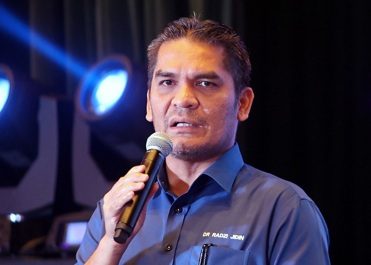 Radzi remains Putrajaya MP after court throws out election petition ...