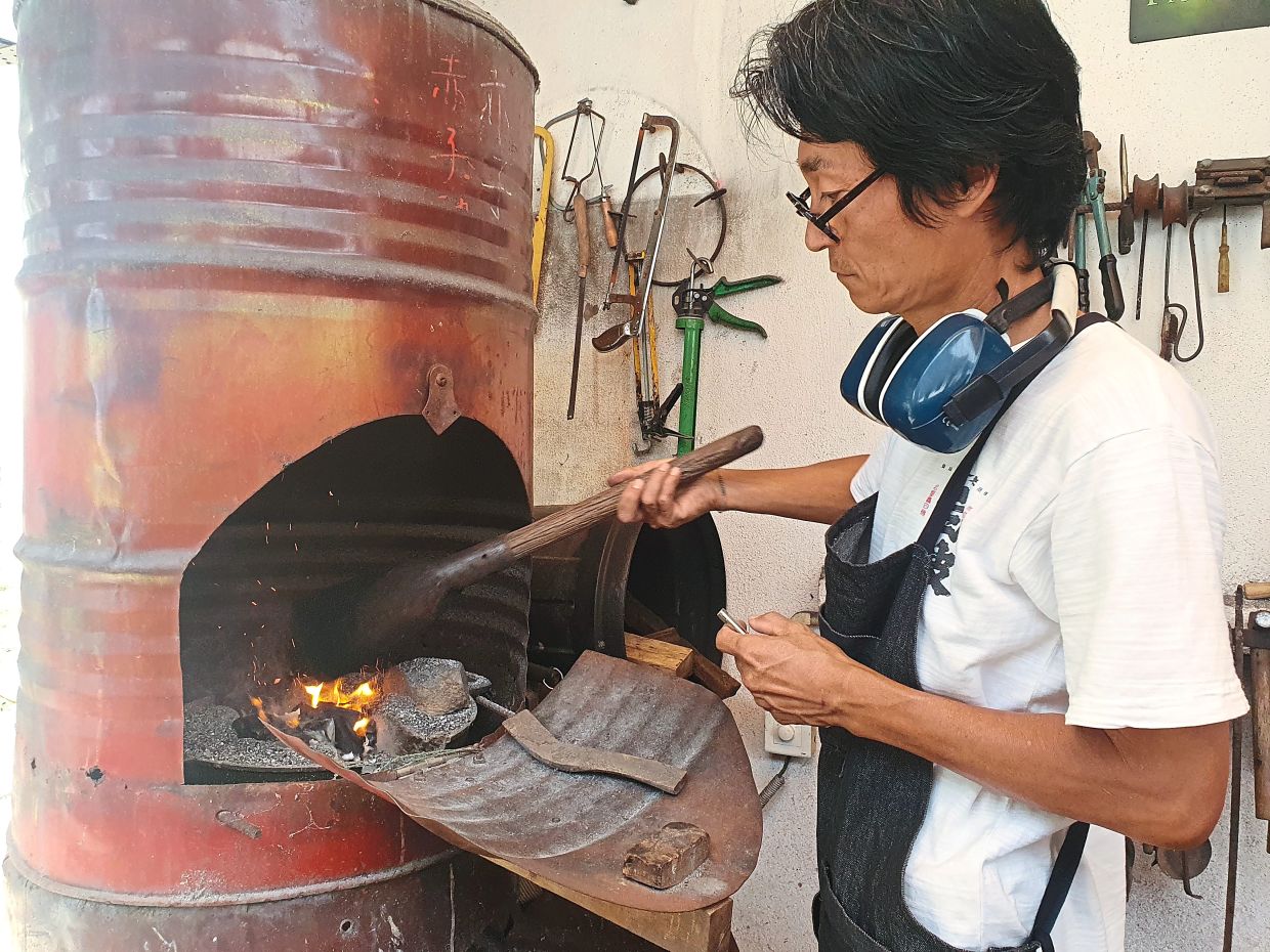 Malaysian tour guide enjoys manipulating metal as a part-time ...
