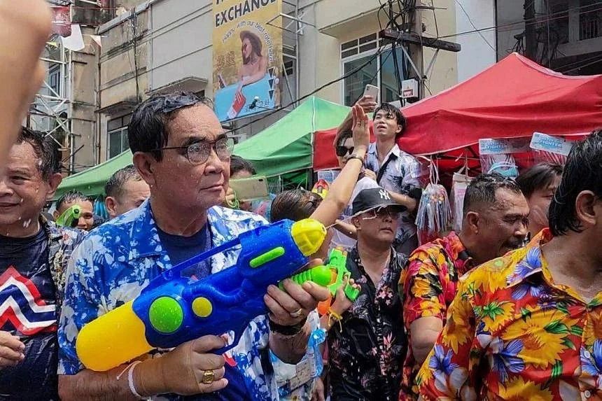 Thai PM Prayut gets a drenching in surprise water fight appearance ...