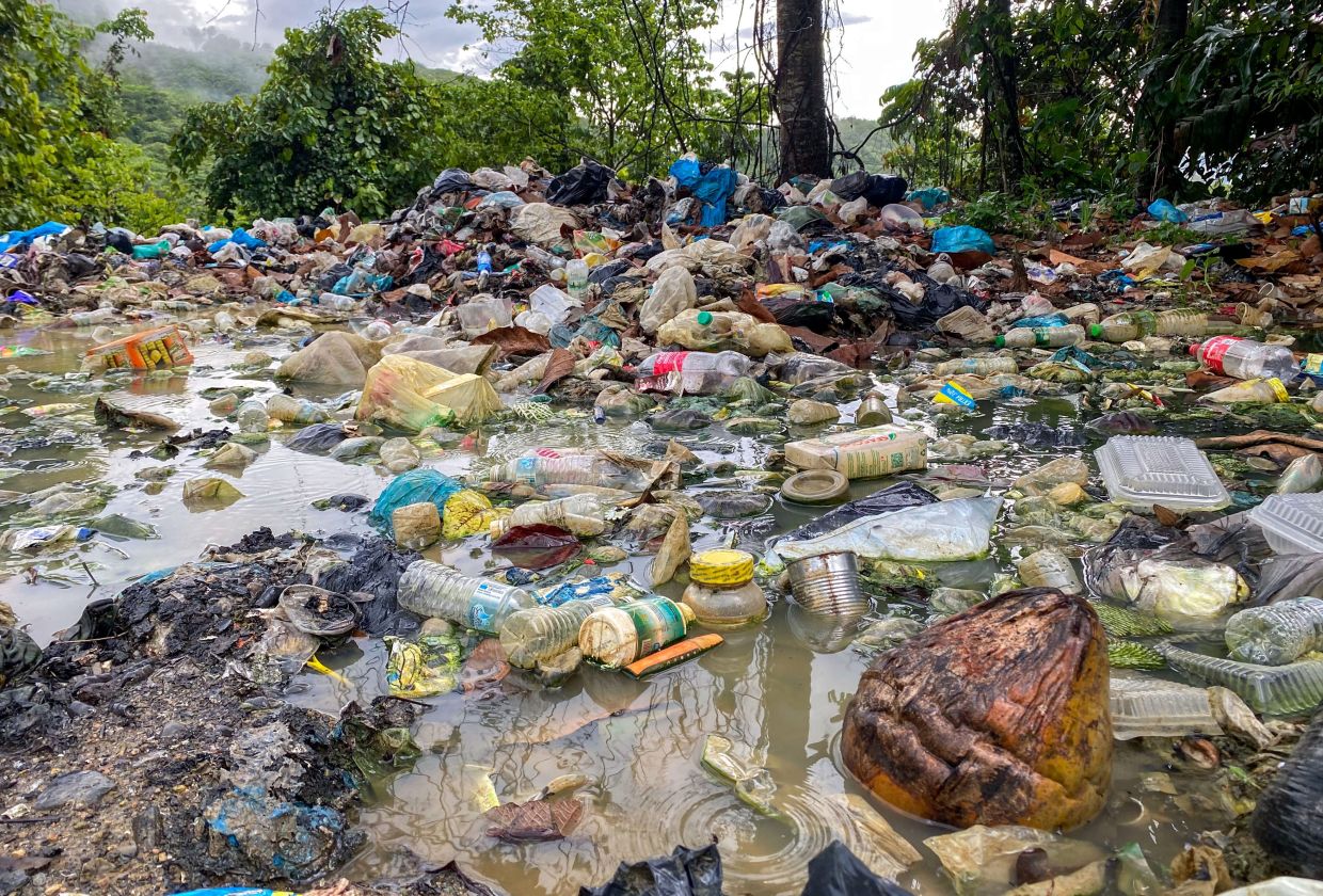 Orang Asli villagers complain of stench from garbage piles on road ...