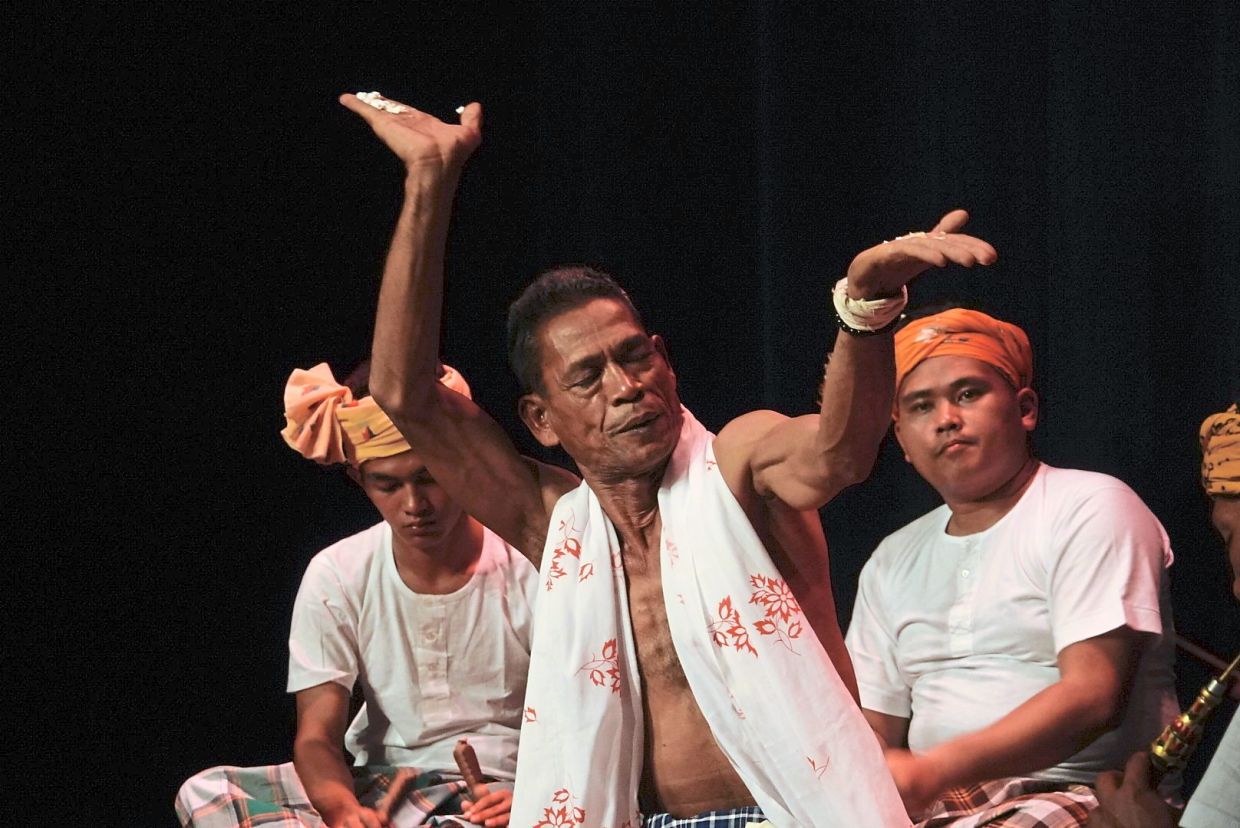 In photos: Kelantanese ancient healing ceremony mesmerises Parisian ...