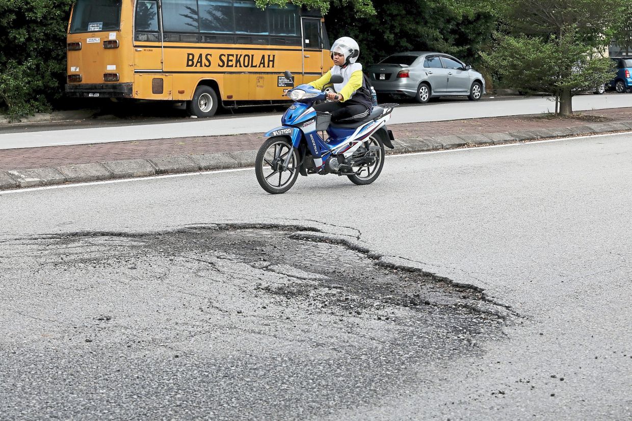 Pothole-riddled road patched up | The Star