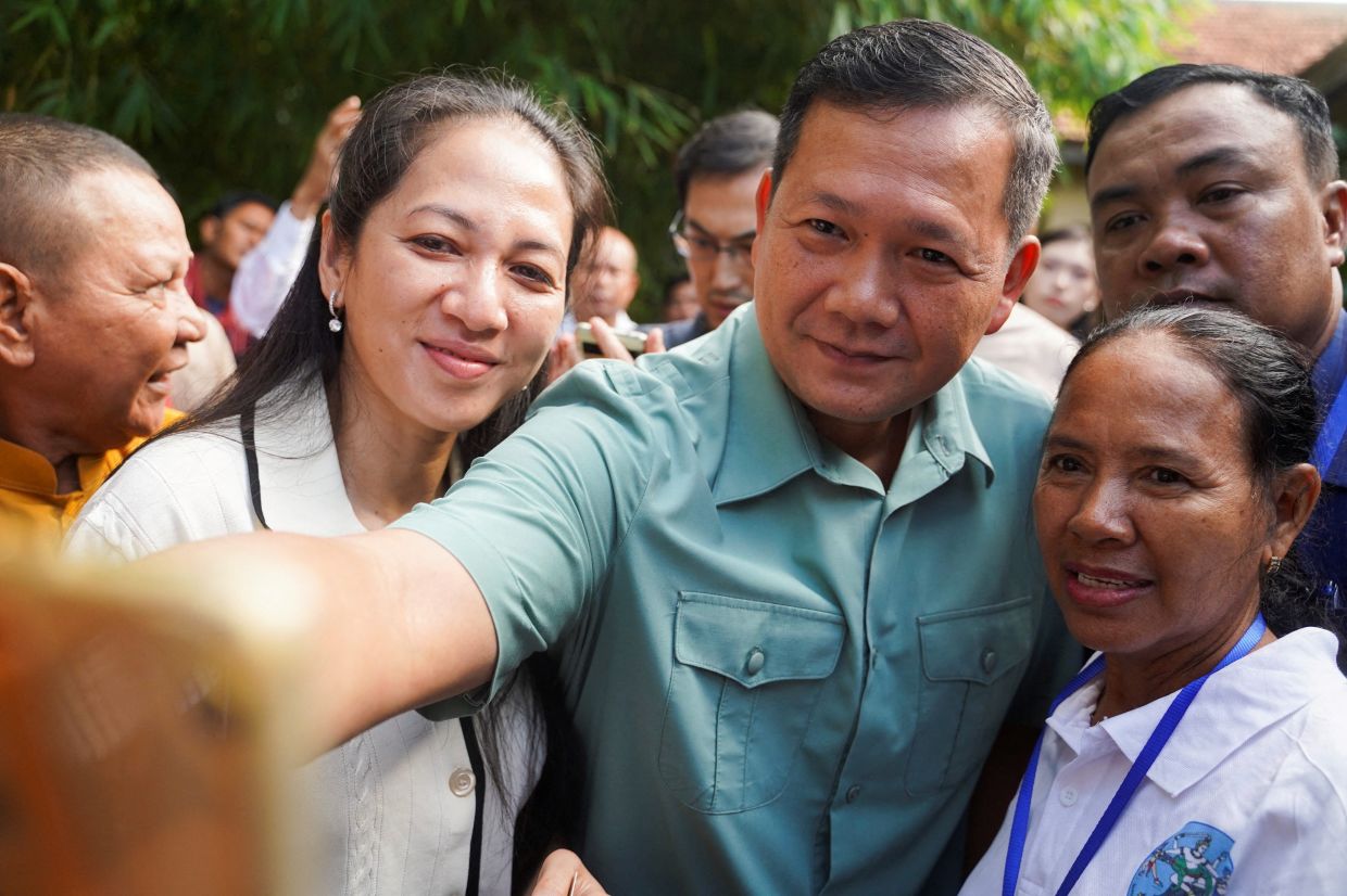 Cambodian heir apparent Hun Manet hails poll victory, defying ...