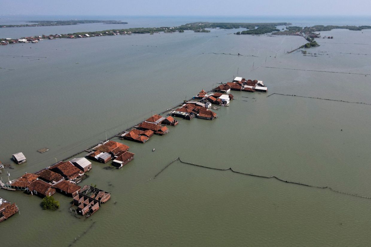 Suffering from climate change: Residents adapt to rising sea levels as ...