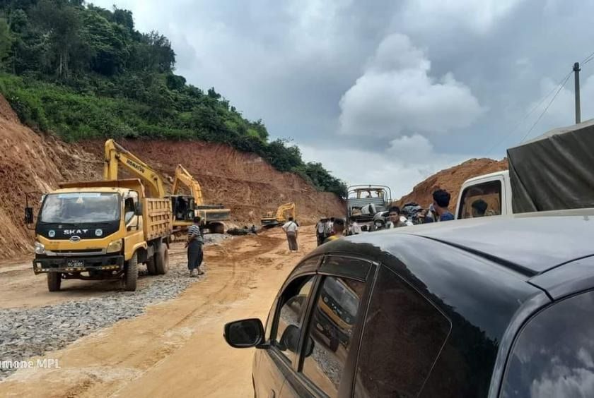 Cars wait in line on New Asia Highway despite sporadic traffic access ...