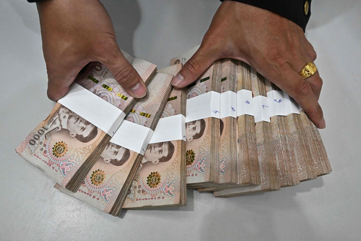 Thai baht, stocks hit multi-month lows on high oil prices | The Star