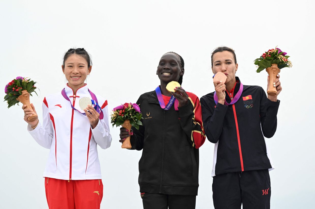Dream comes true as China's He wins Asian Games marathon; Bahrain ...