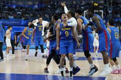 Basketball players from the Philippines and Jordan, the top two teams ...
