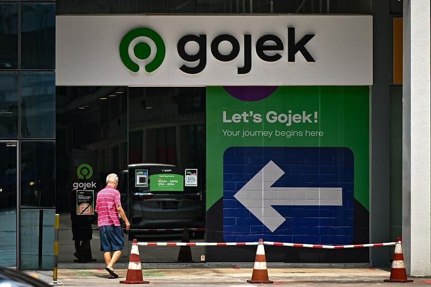 Gojek drivers to pay less commission, but passengers to pay fee for ...