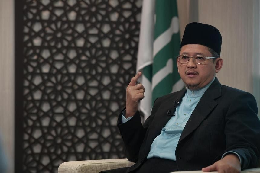 Singapore’s former mufti warns followers about possible investment scam ...