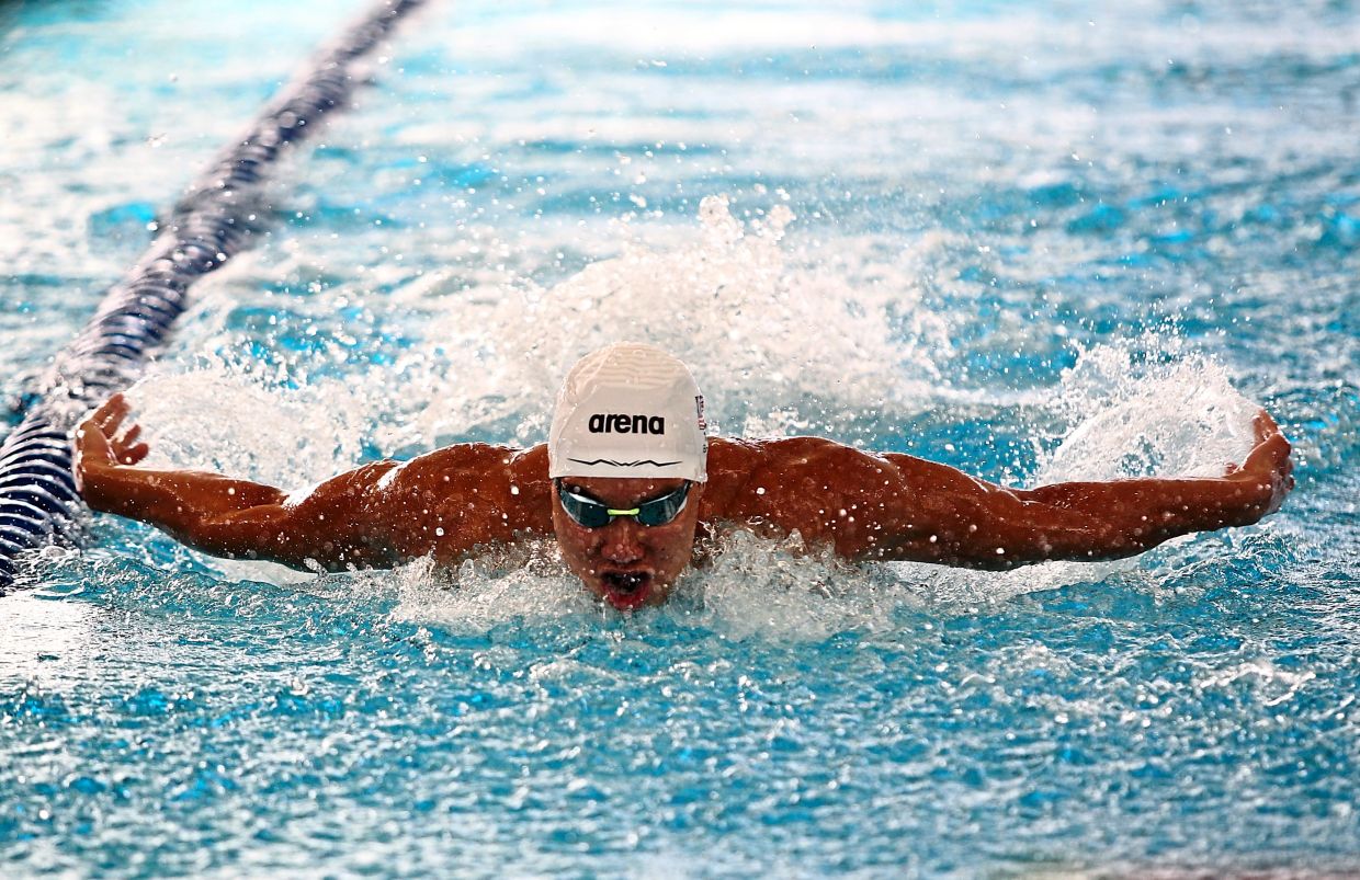 Swimming: Bryan sets new national butterfly record in world meet | The Star