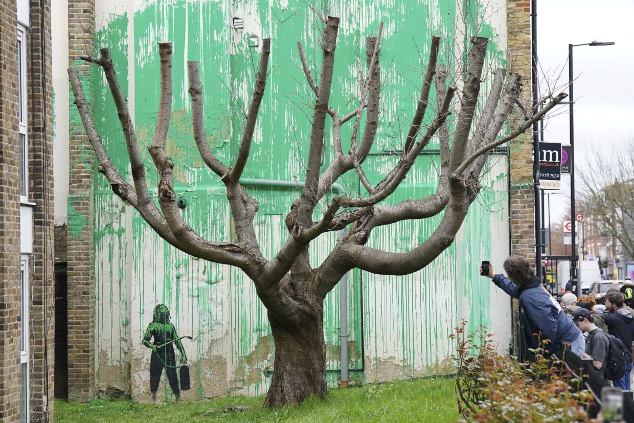 New Banksy mural sprouts beside cropped tree in London; is it an ...