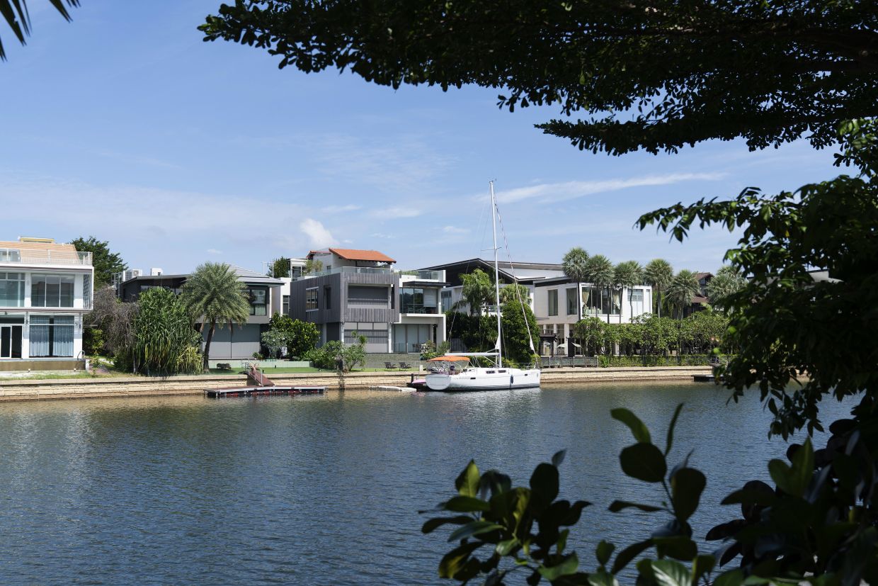 Sentosa Cove condos snapped up after 40% price slash | The Star