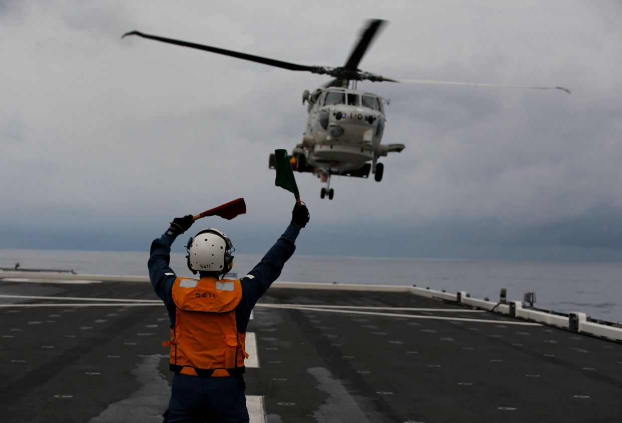 Two Japanese navy helicopters crash in the Pacific Ocean during ...