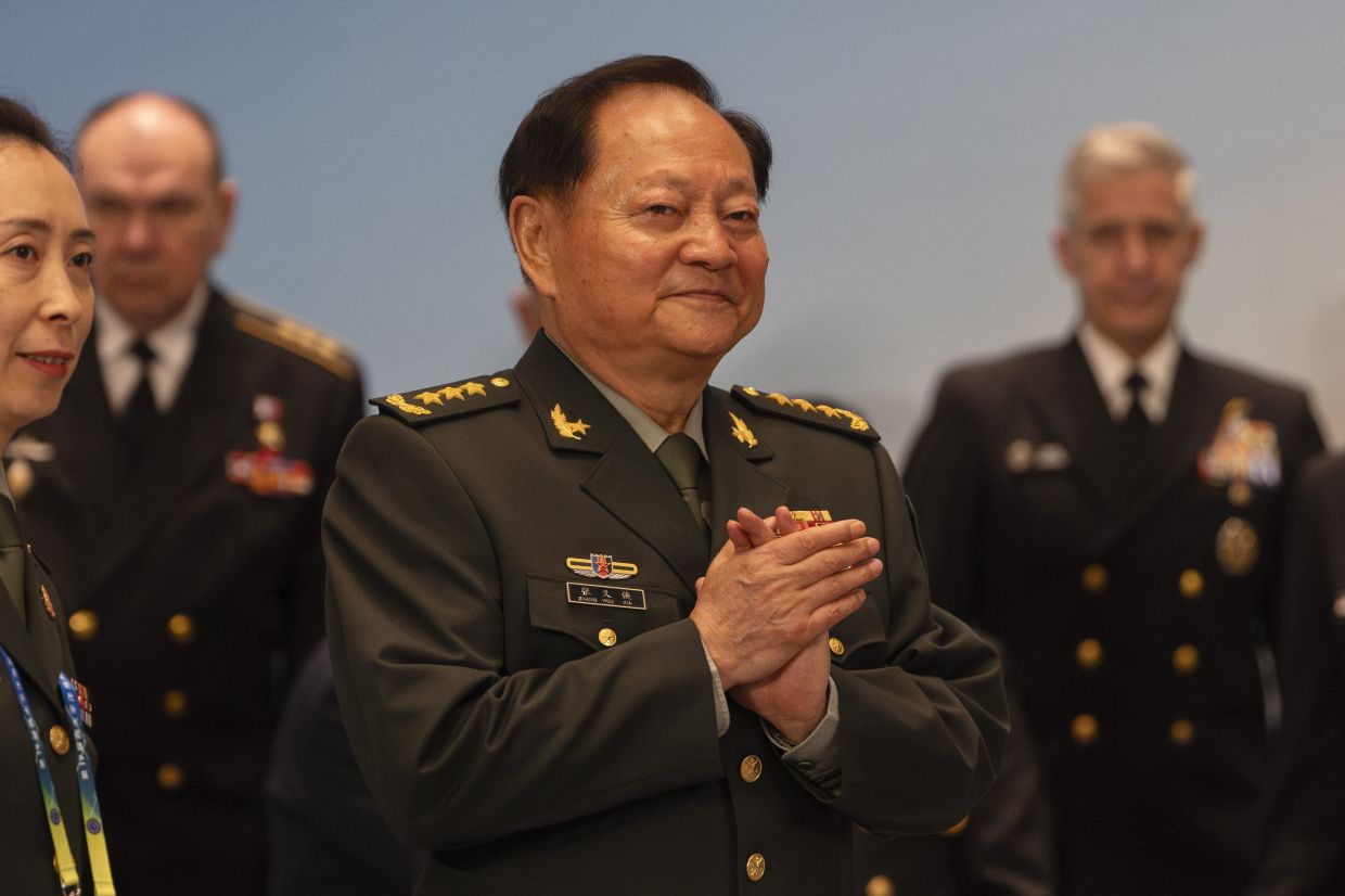 Chinese general takes a harsh line on Taiwan and other disputes at ...