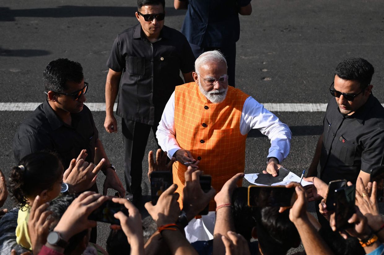 PM Modi votes as India's marathon election heats up | The Star