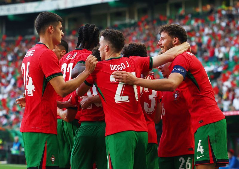 Football: Soccer-Portugal survive late scare in 4-2 friendly win over ...