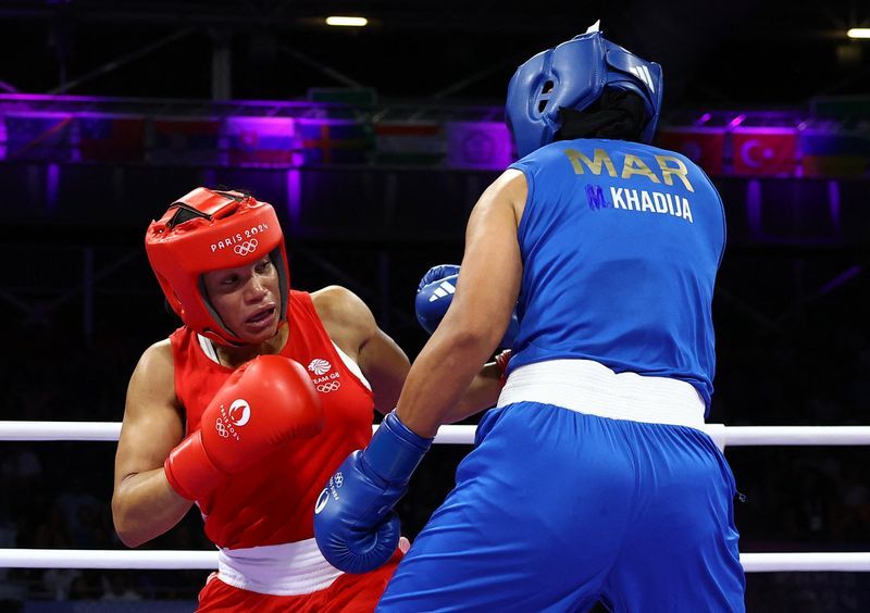 Boxing: Olympics-Boxing-Harrington and Fereira make history, set up ...
