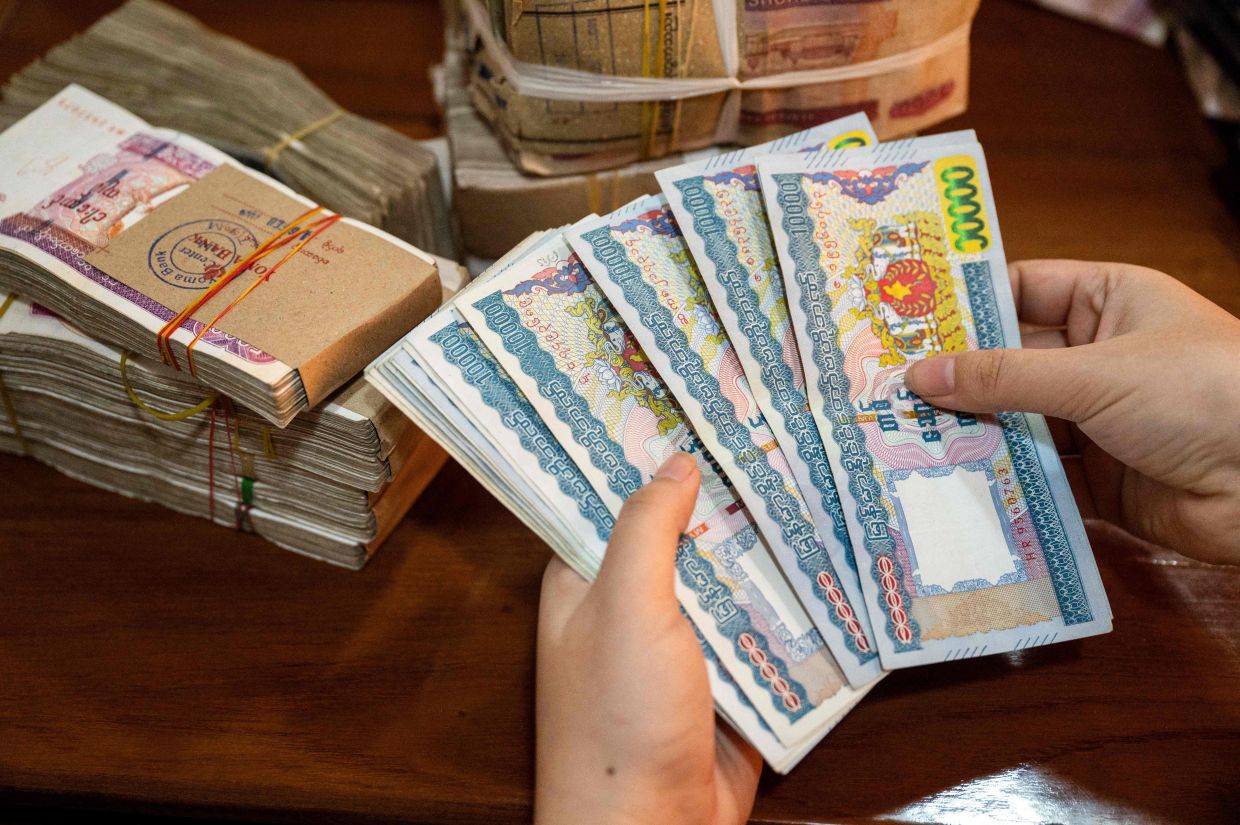 Myanmar households crippled as currency tumbles to record low | The Star