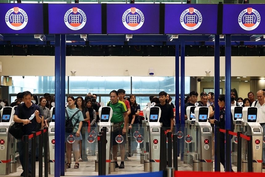 Woman arrested after attempting to take ICA officer’s gun at Woodlands ...