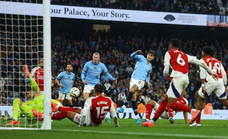 Football: Soccer-Stones' stoppage-time leveller earns Man City 2-2 draw ...