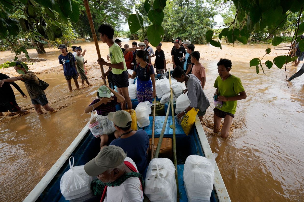 Malaysians brave choppy waters to send aid to Myanmar flood victims ...