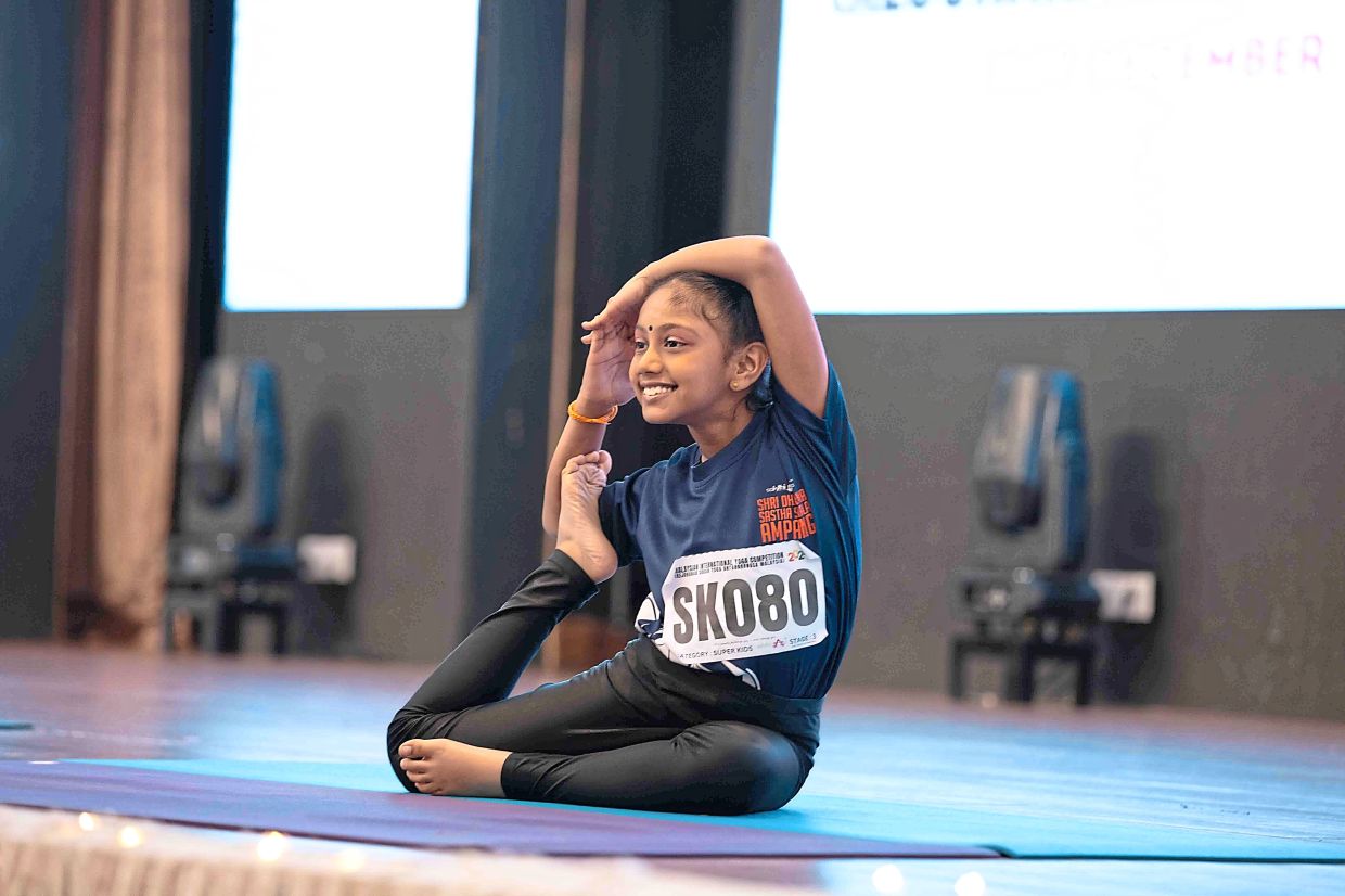 Stretching limits to set yoga records | The Star
