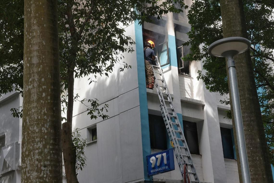 Two dead, residents evacuated from seven floors of Hougang HDB block in ...