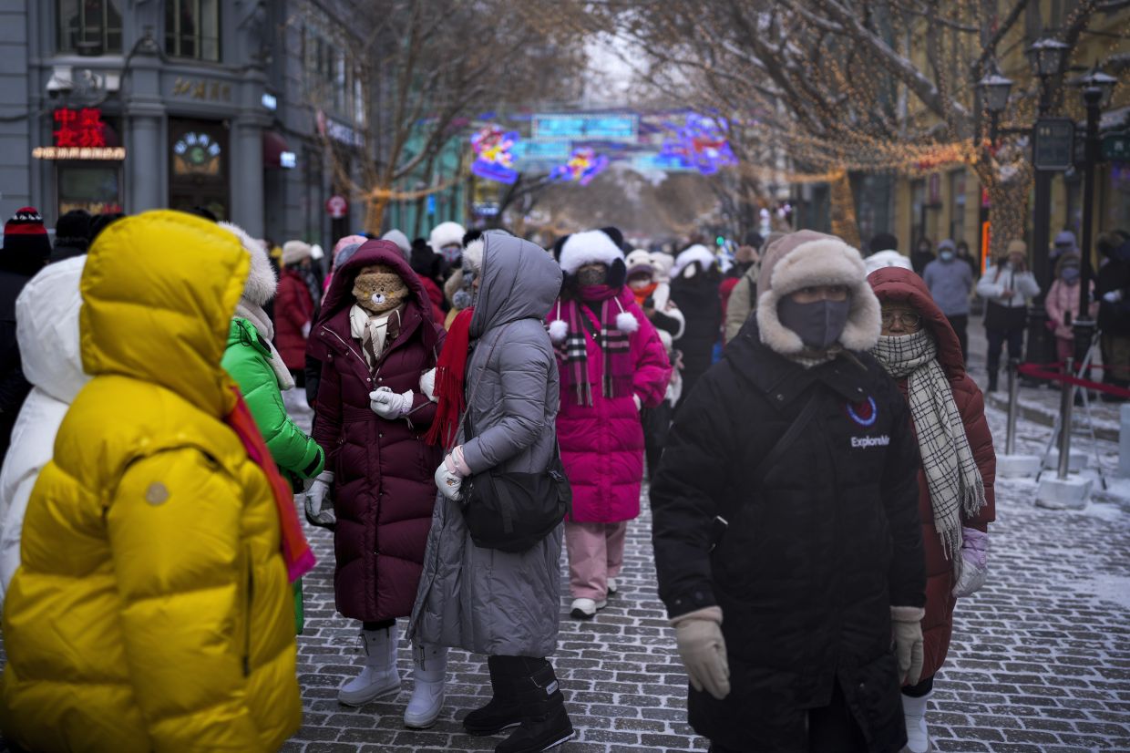 Warm clothing, hot pot and even ice cream bars feature at China's ice ...