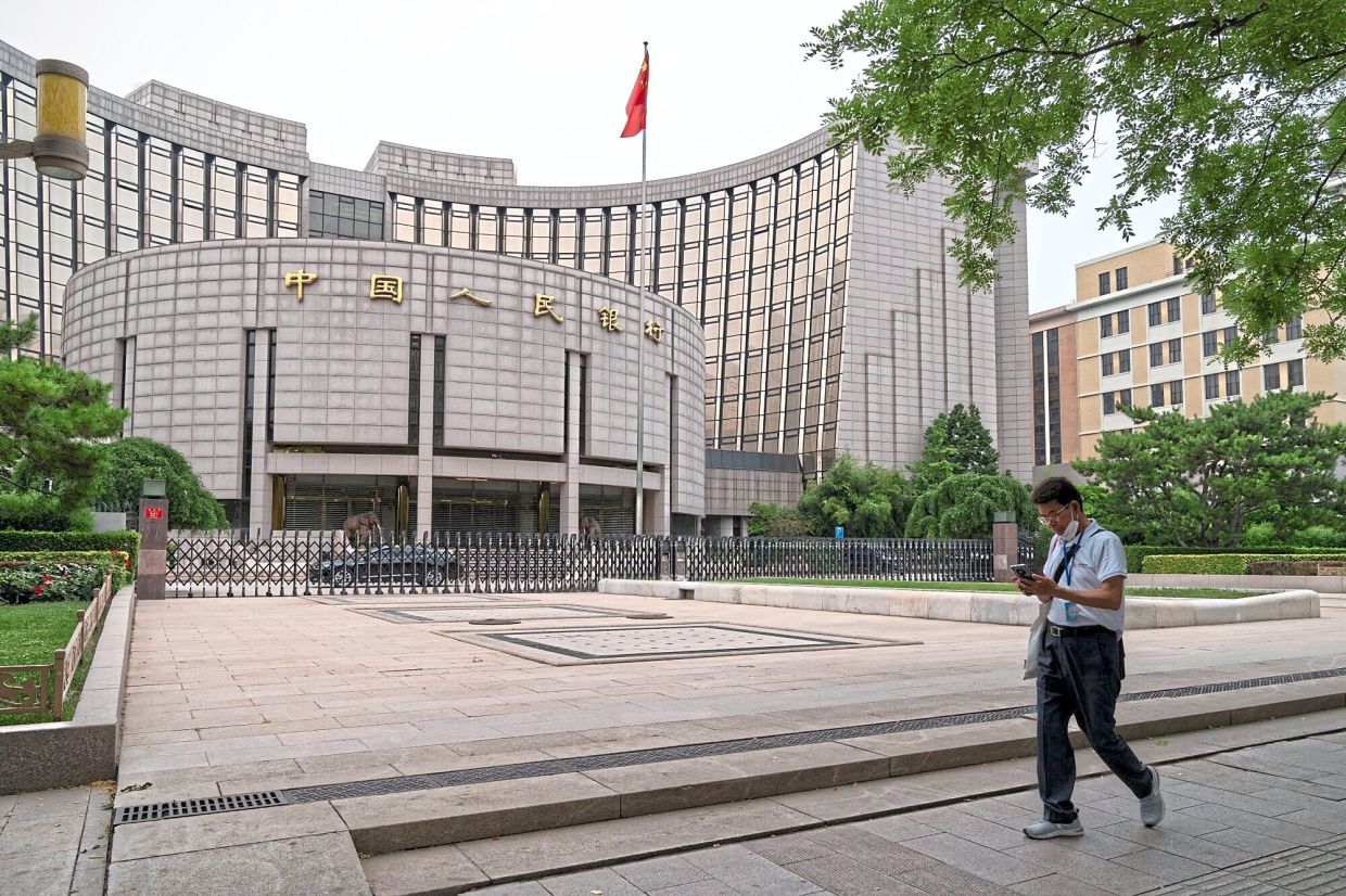 China boosts yuan support with warning, capital control tweaks | The Star