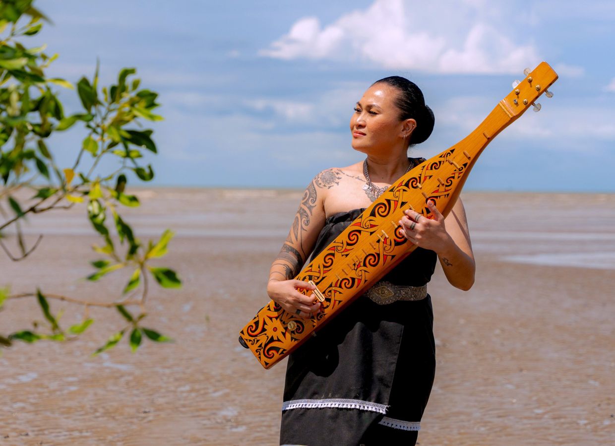 Sarawakian sape player reflects on motherhood and crafting memories ...