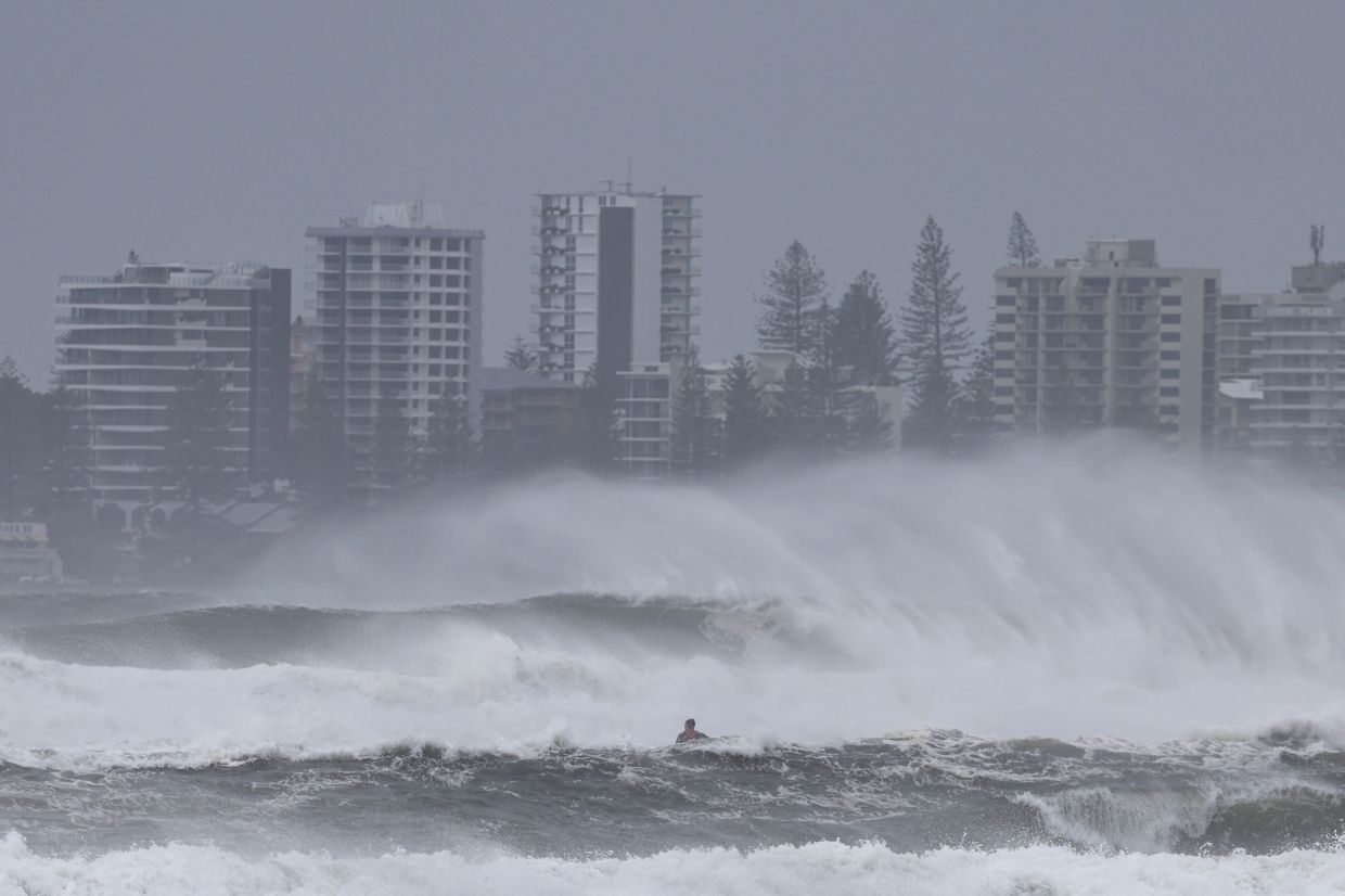 Cyclone Alfred stalls off Australia's east, residents sandbag homes ...