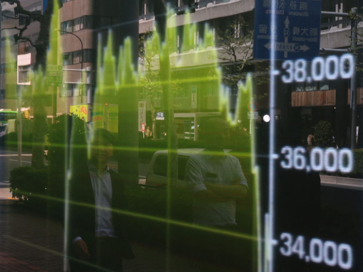 Asian markets mixed as traders track tariff talks | The Star