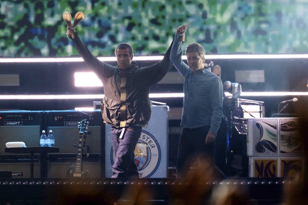 British rock legends Oasis kick off 'historic' comeback tour | The Star