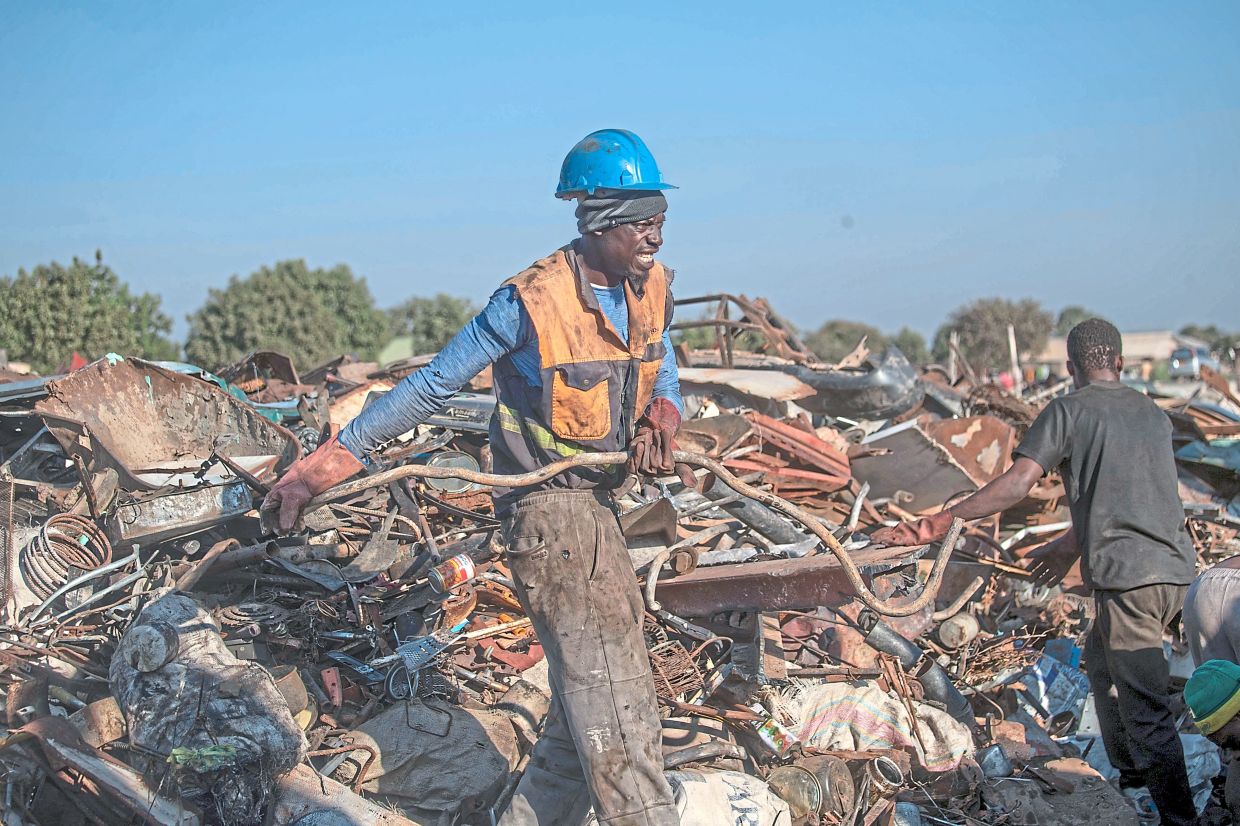 Zimbabwe's scrap metal hunters quietly fight climate change, one piece ...
