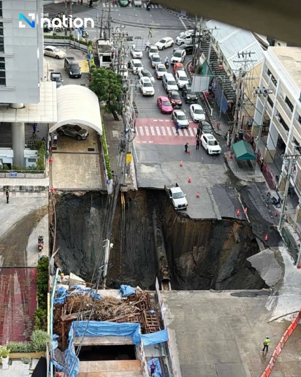 Bangkok police relocate officers after road subsidence near Vajira Hospital | The Star