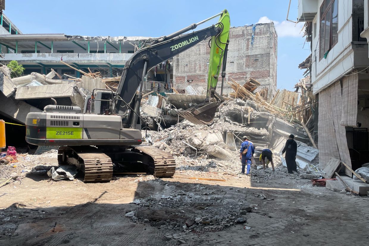 Indonesia's East Java school collapse leaves 10 dead after five more bodies recovered at site ...