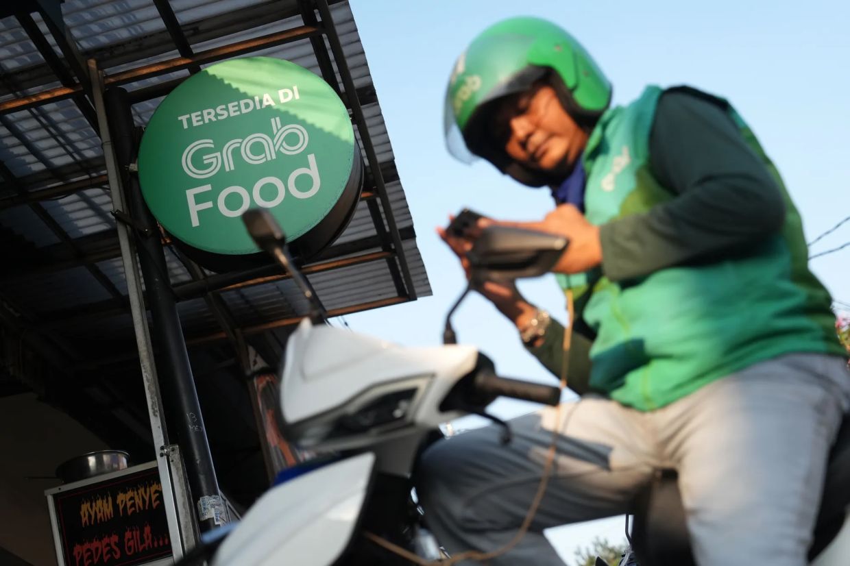 Grab Holdings raises full-year earnings forecast | The Star