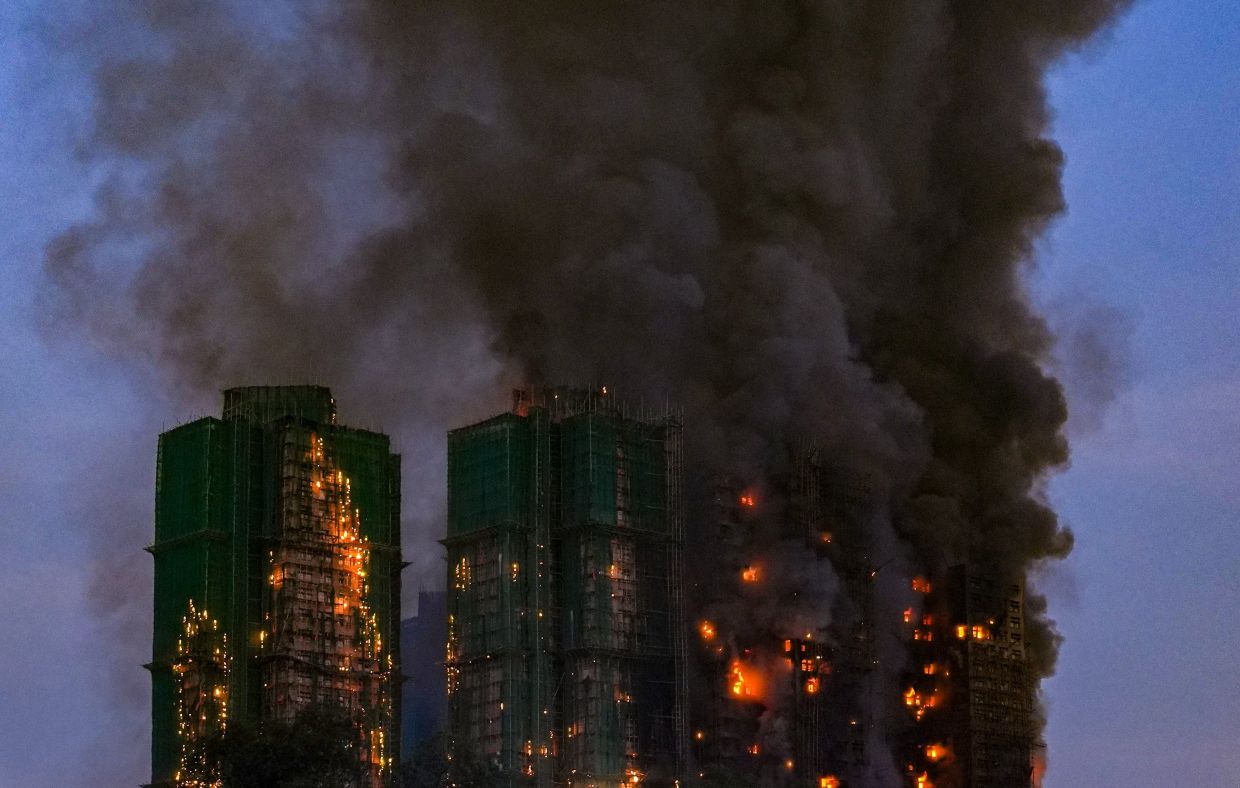 Poor fire retardance, alleged worker smoking among fatal Hong Kong ...