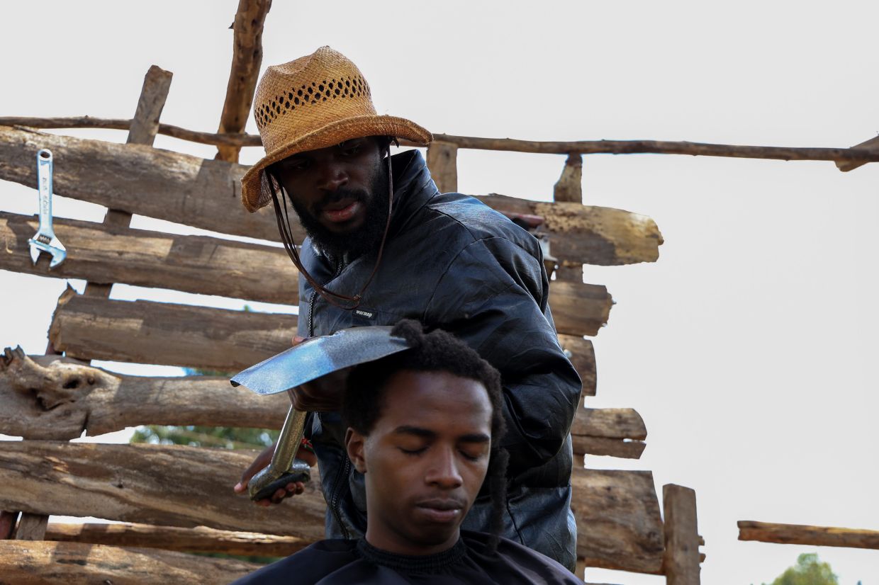 A Kenyan barber who wields a sharpened shovel thrives on Africa's ...