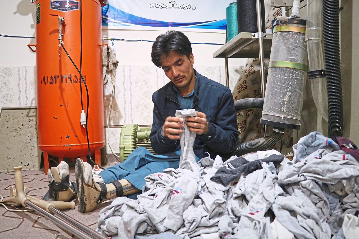 Afghan polio survivor’s sock factory provides hope by employing ...